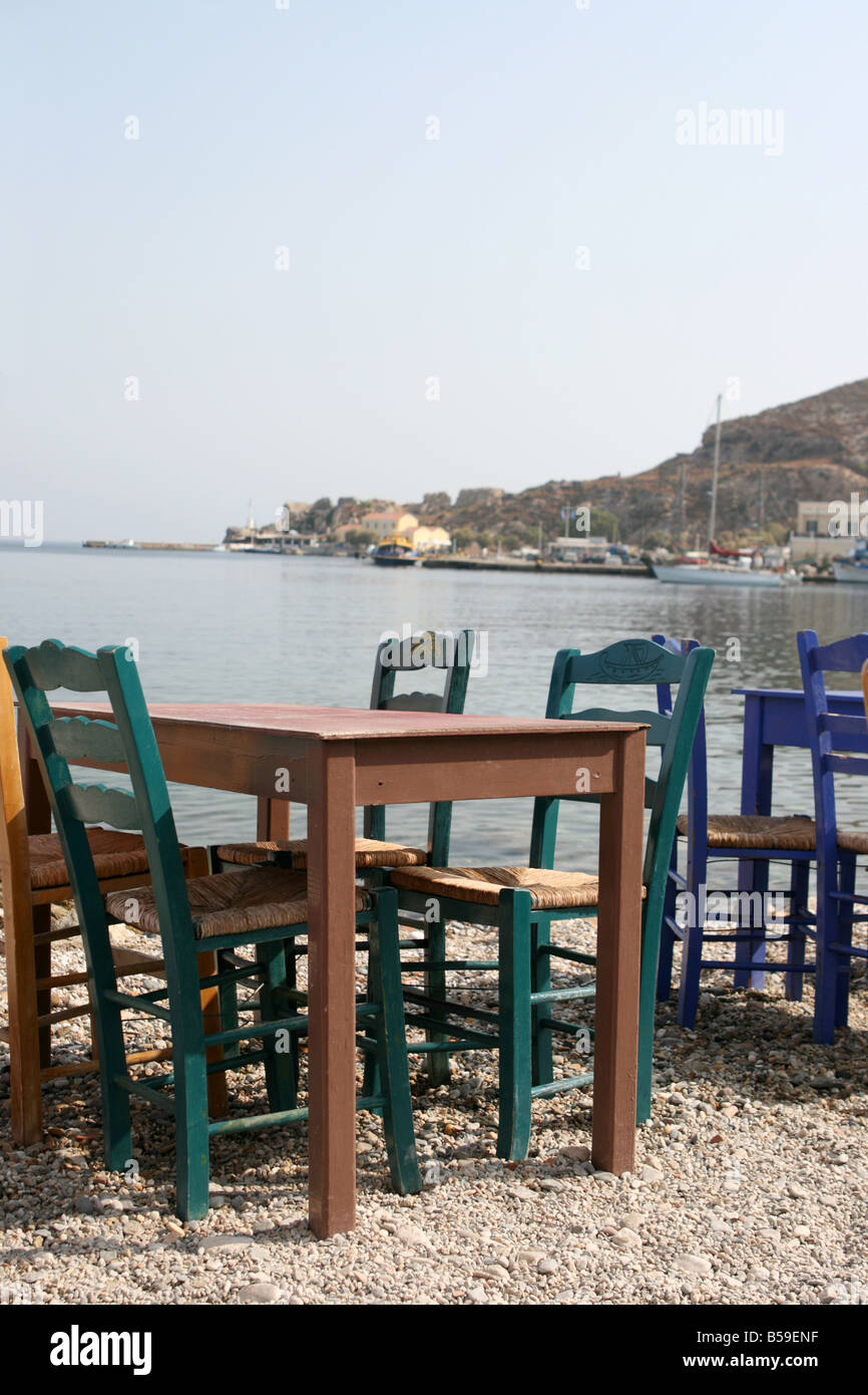 traditional tables and chairs at greek taverna by the sea Stock Photo ...