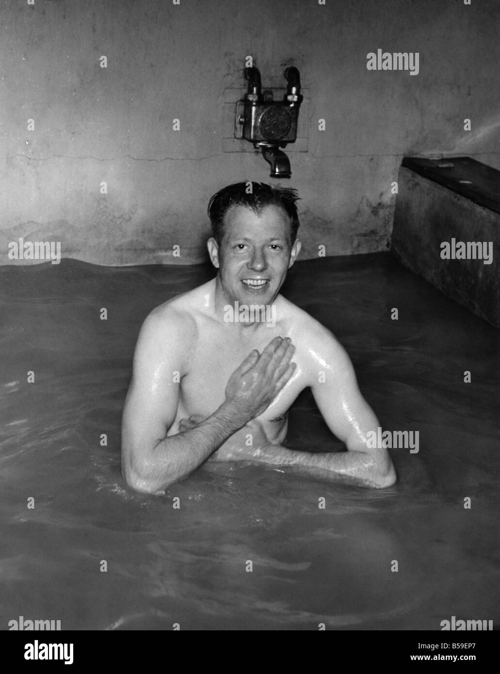 Manager Bert Flatley, ex-Buckley-boy, enjoys a bath after playing with ...