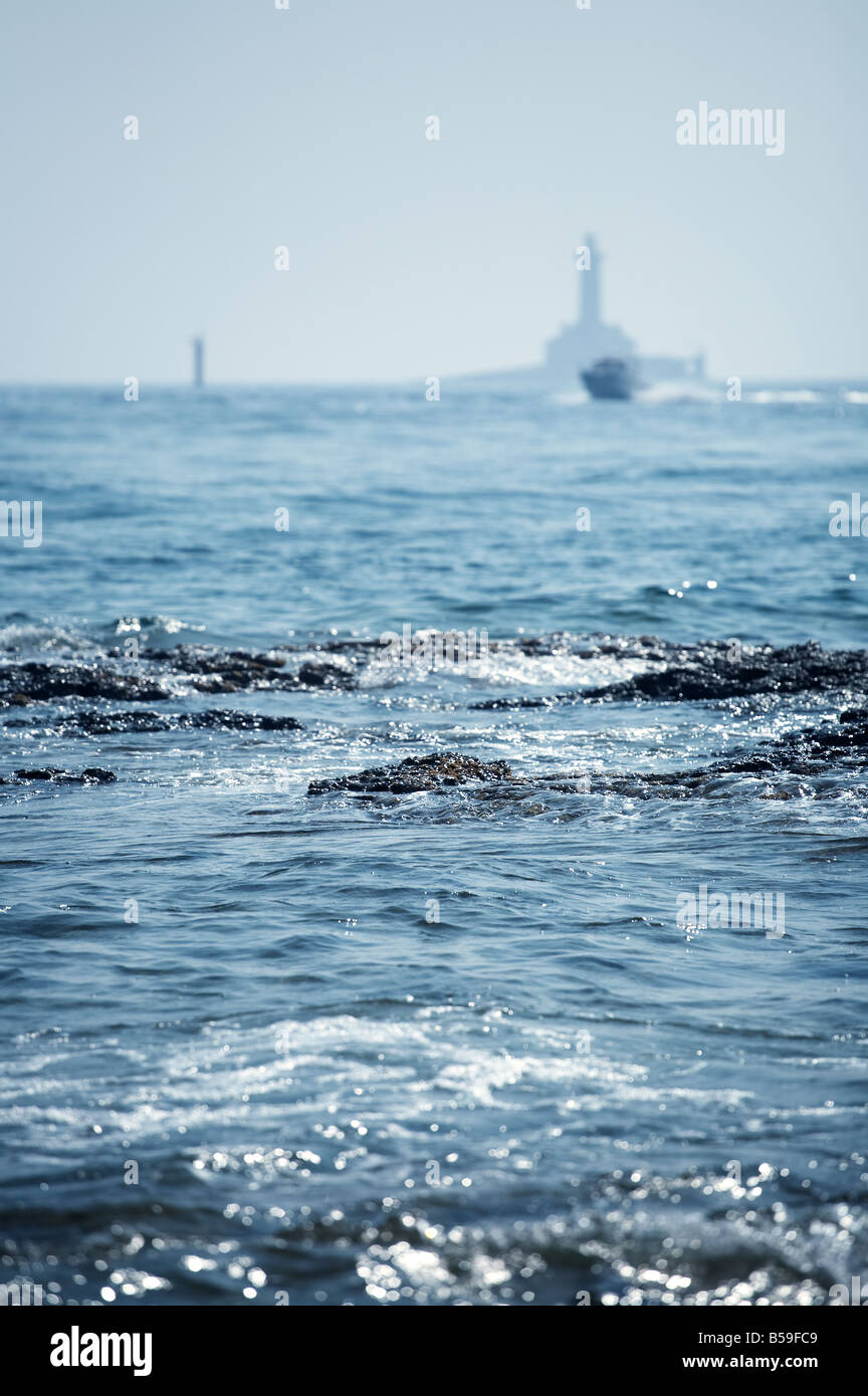 Rocky Croatian beach ,Porer lighthouse in the background Stock Photo ...
