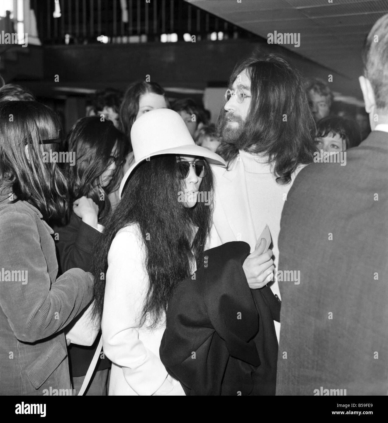 Beatles singer songwriter John Lennon and wife Yoko Ono pictured at Heathrow today. April 1969 ...