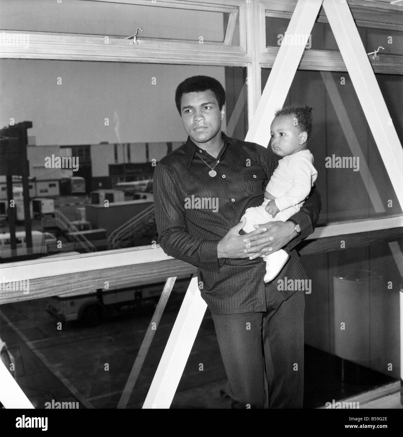 Mohammad Ali with baby Hanna at Heathrow Airport today. August 1977 77 ...