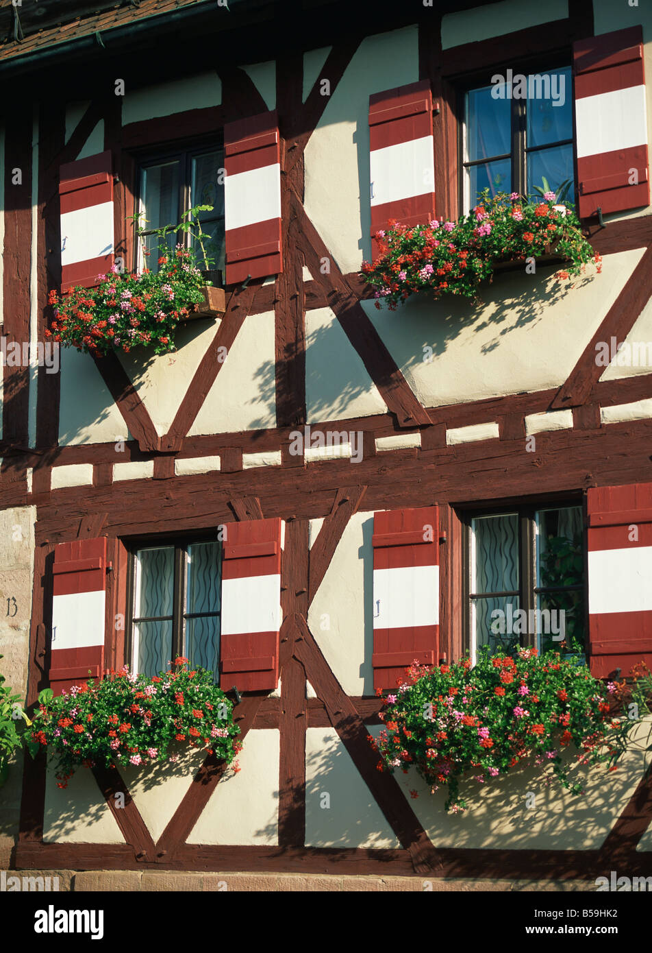 Flower baskets on half-timbered wall, Kaiserburg, Nuremberg, Bavaria ...