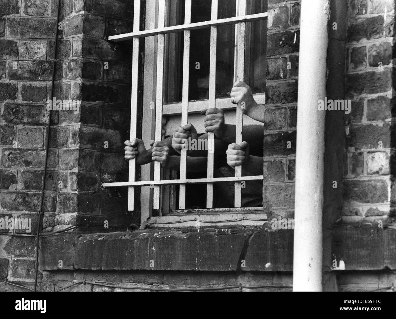 Hands at the bars of a window at Liverpool's Walton Prison. July 1975 ...