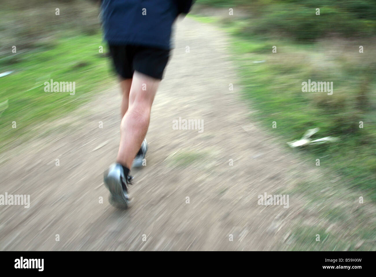 fast overweight man runner on country lane Stock Photo - Alamy