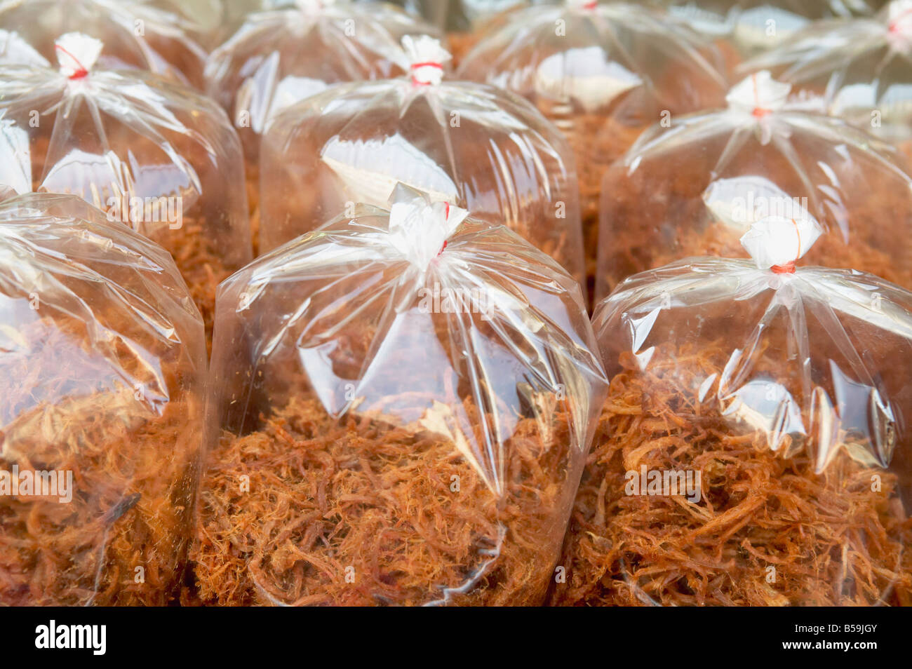 Dried squid bagged in market Stock Photo - Alamy