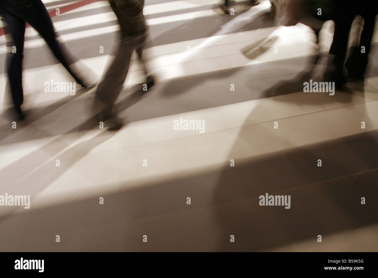 detail of people legs walking fast in street at night Stock Photo - Alamy