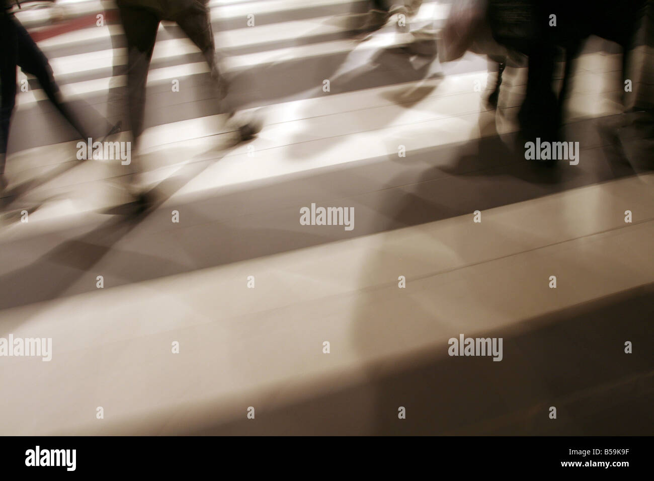 detail of people legs walking fast in street at night Stock Photo - Alamy