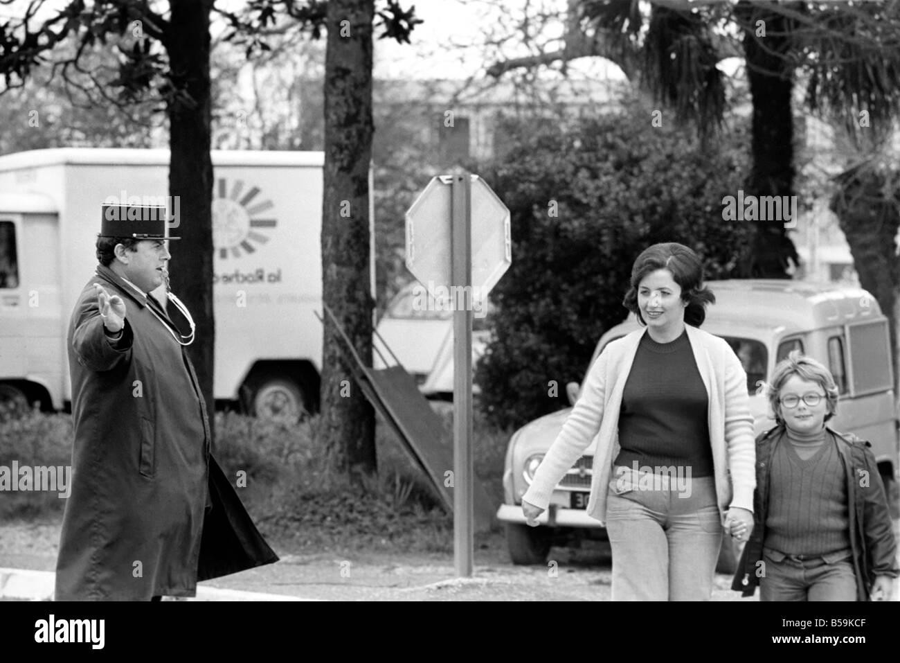 A French Gendarme holds up the traffic as Mrs. Maria Quaranta aged "36 ...