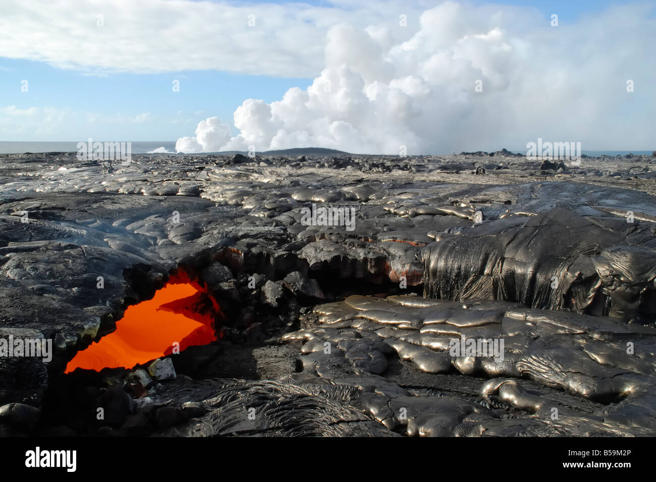 Skylight and flowing lava Waikupanaha ocean entry lava flow area Stock ...