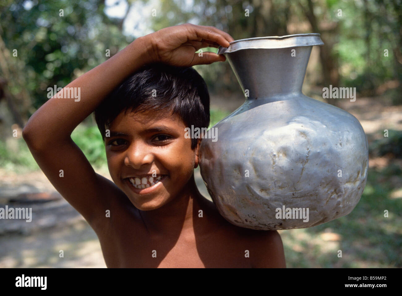 Carrying water pot on shoulder hi-res stock photography and images - Alamy