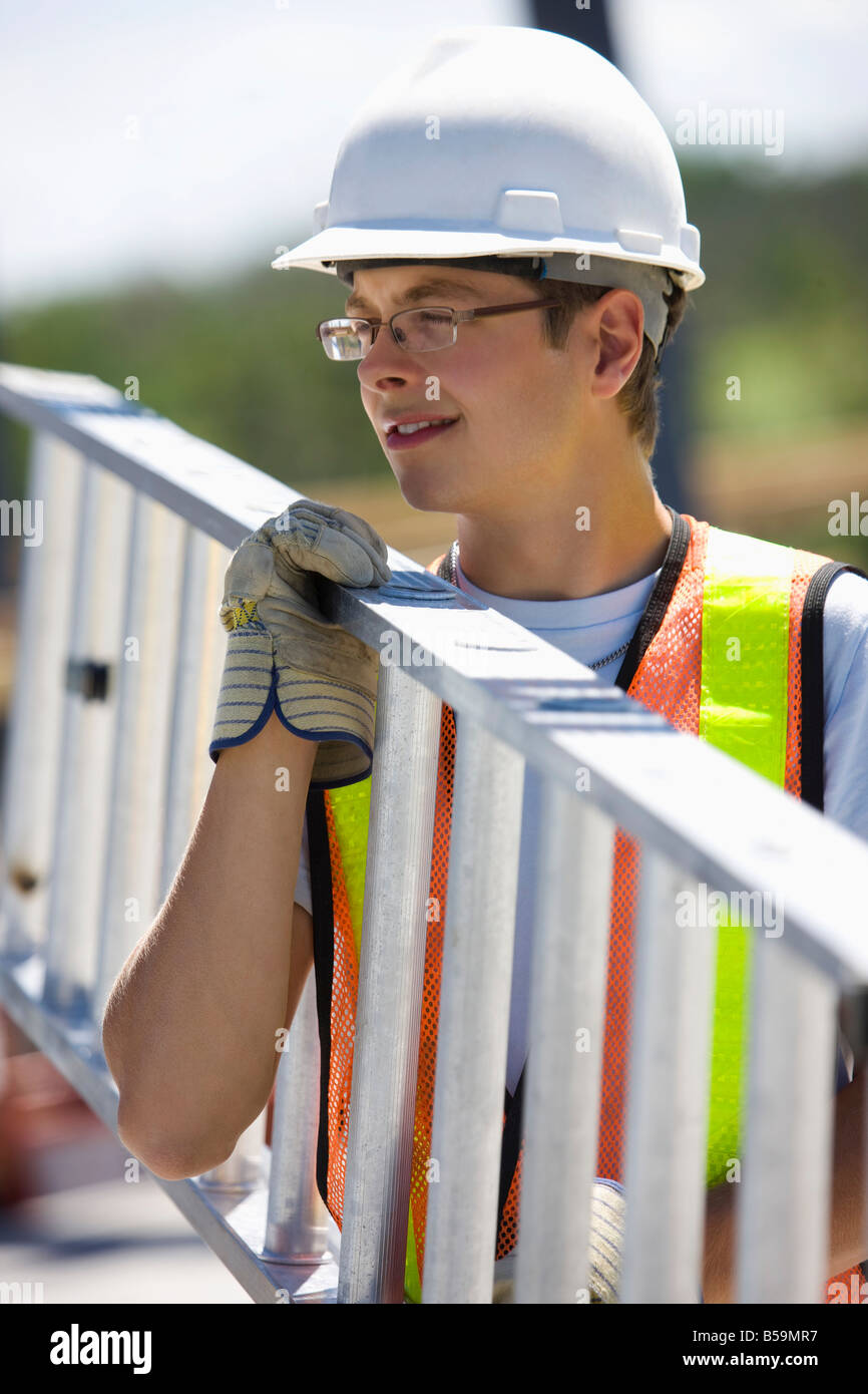 Construction worker carrying ladder hi-res stock photography and images ...