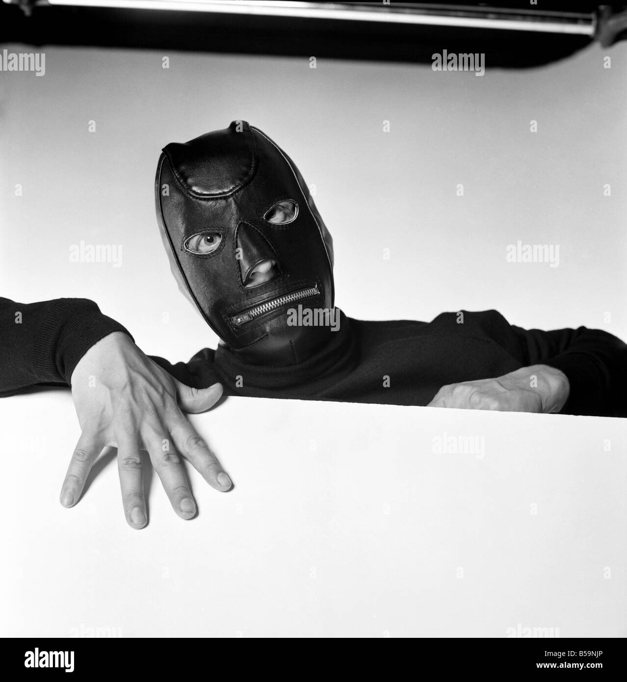 Horror: Crime: Mask: Unusual: Man wearing leather hood. May 1975 Stock ...