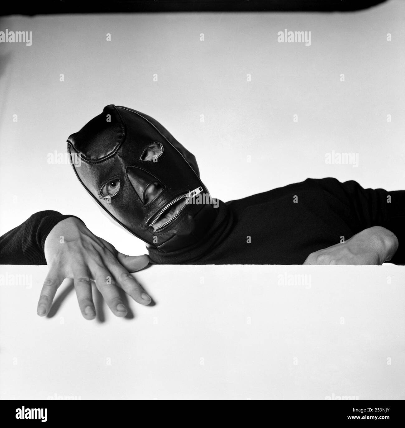 Horror: Crime: Mask: Unusual: Man wearing leather hood. May 1975 Stock ...