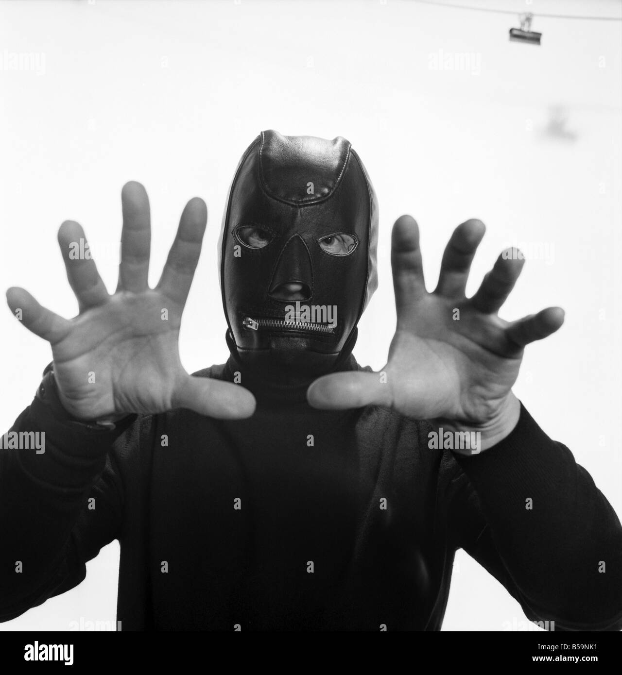 Horror: Crime: Mask: Unusual: Man wearing leather hood. May 1975 Stock ...