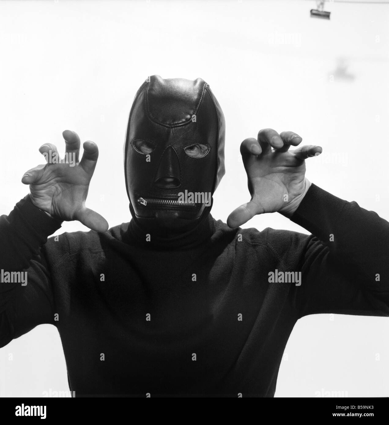 Horror: Crime: Mask: Unusual: Man wearing leather hood. May 1975 Stock ...