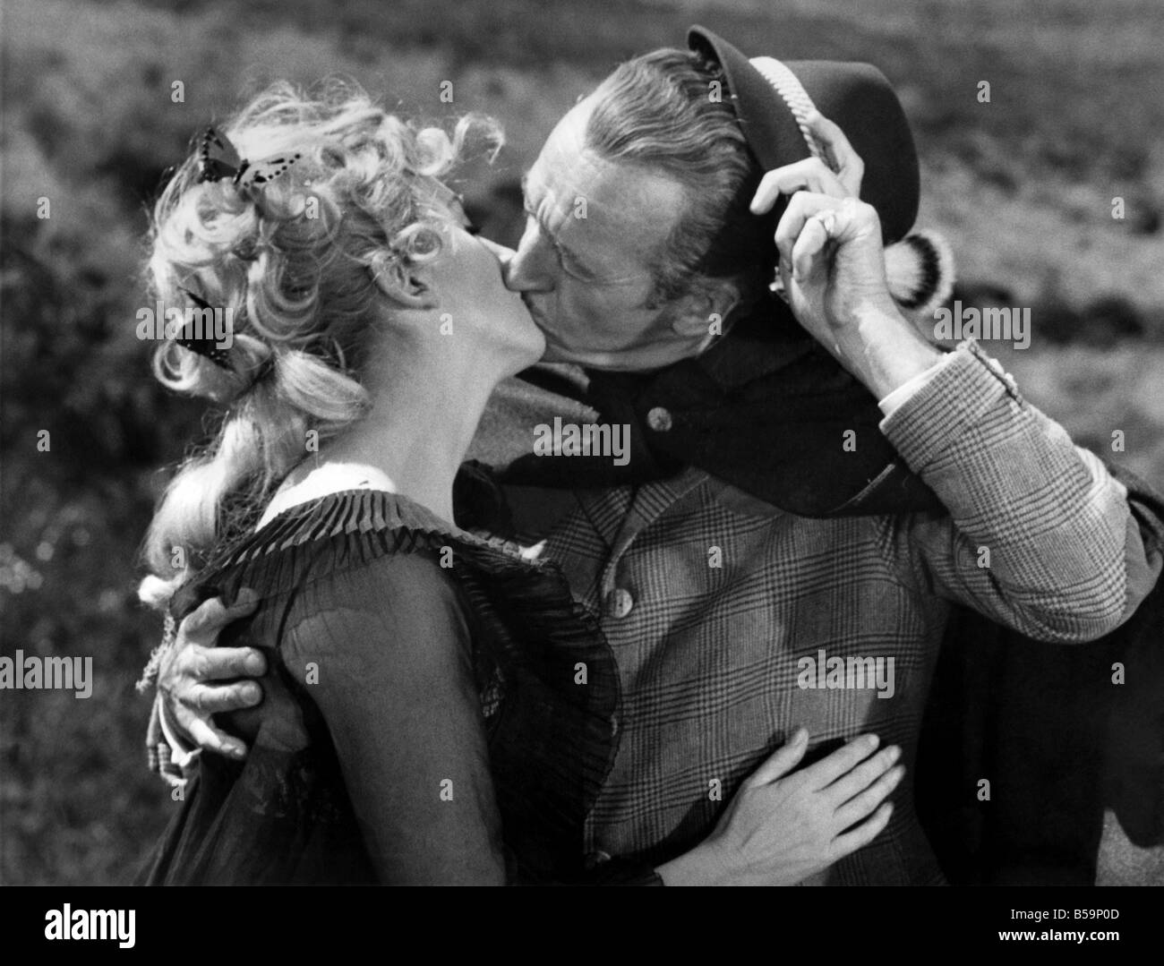 Mr. David Niven, the ever-willing pupil, obeys his master's bidding ...