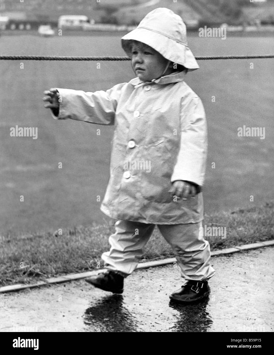 Durham Miners Gala Young Andrew Mangan is prepared for the wet weather ...