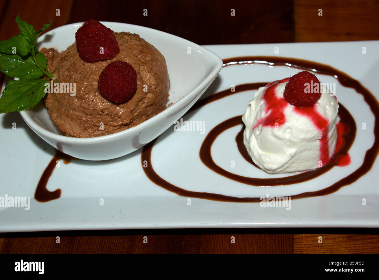 Chocolate gelato with raspberries and whipped cream Stock Photo - Alamy