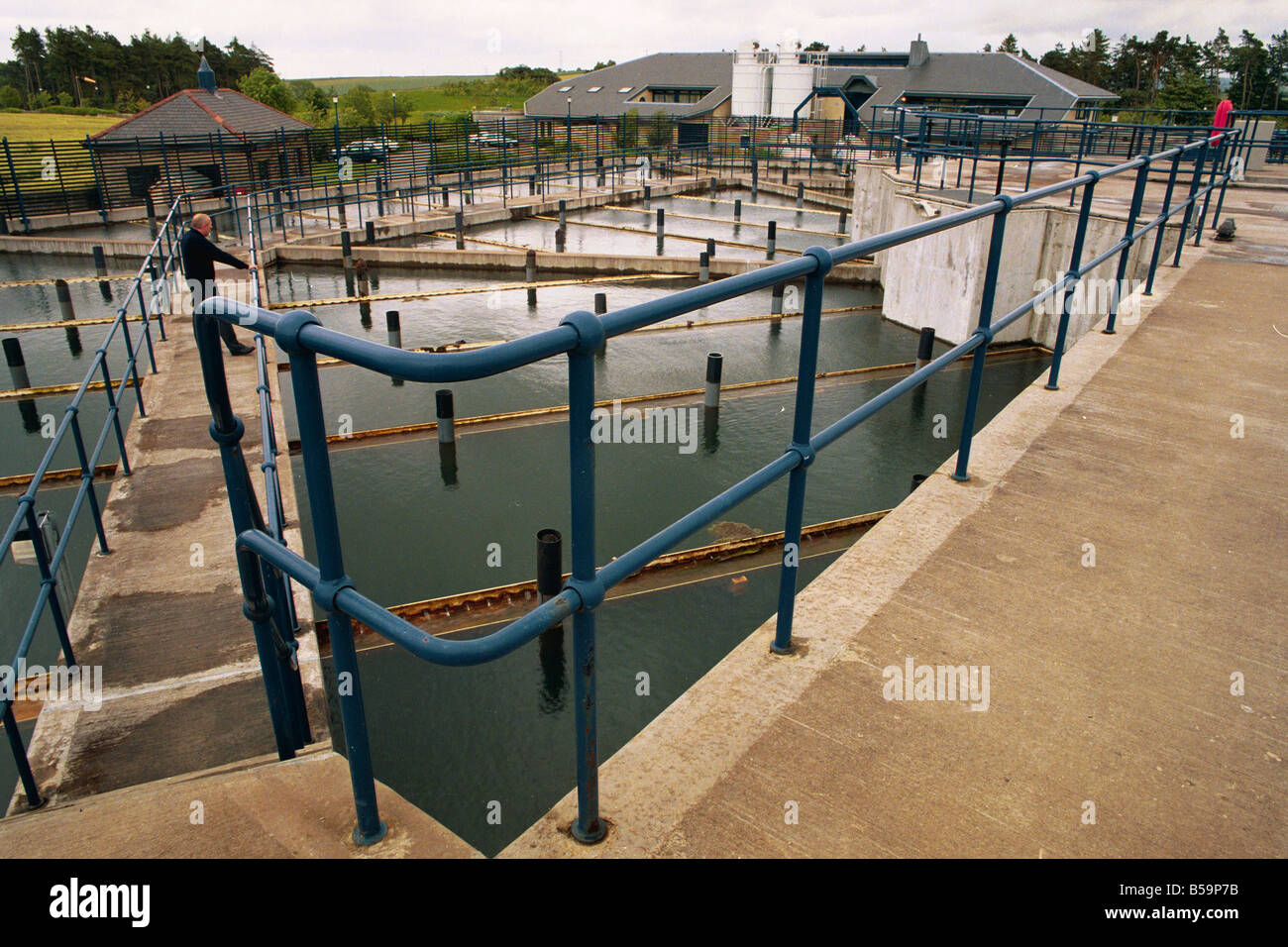 A series of pictures which show water from source in a reservior to tap ...