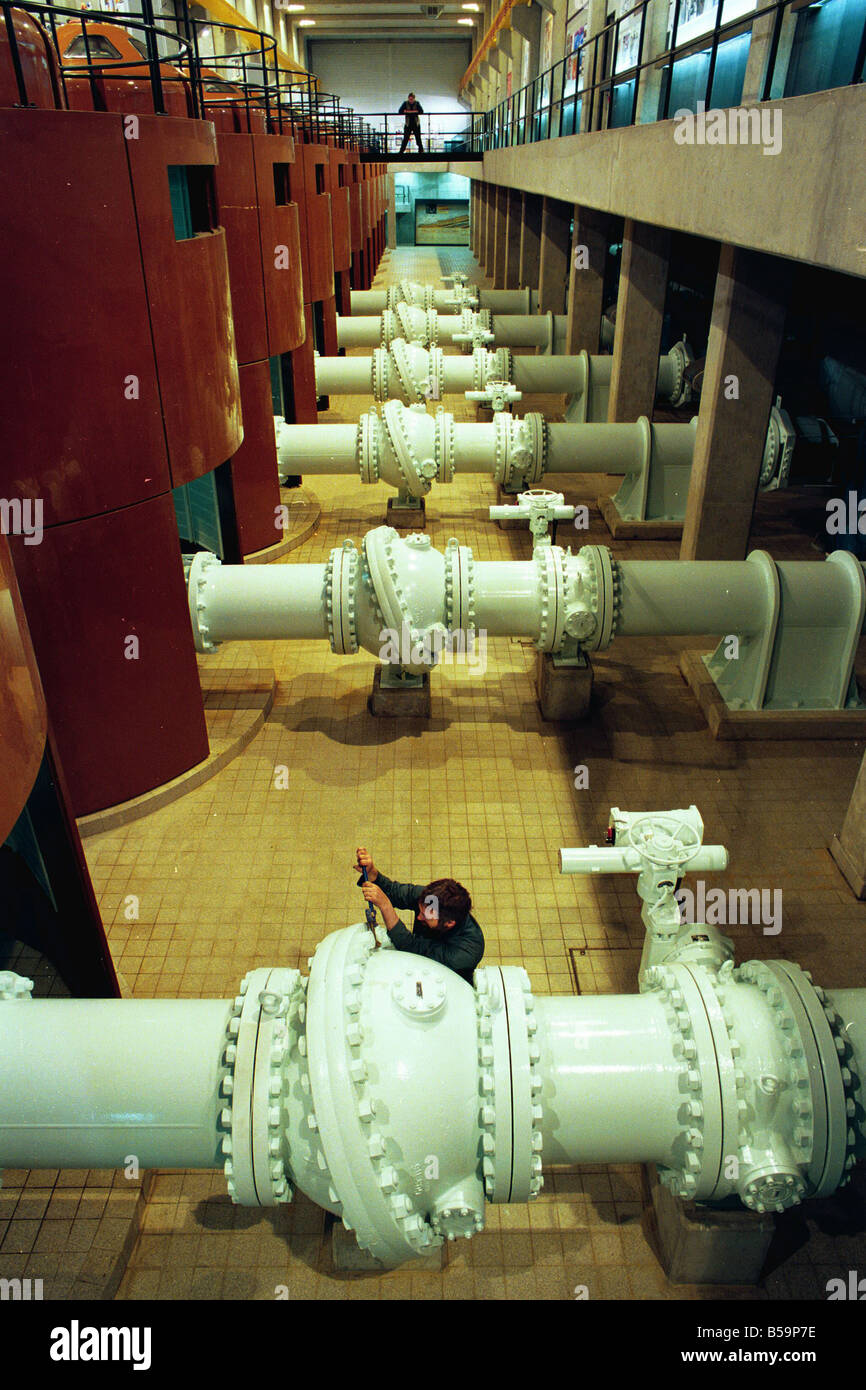 A series of pictures which show water from source in a reservior to tap ...