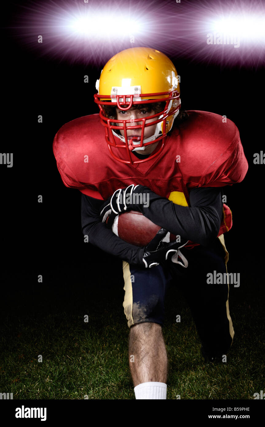 American football player catching ball hi-res stock photography and ...