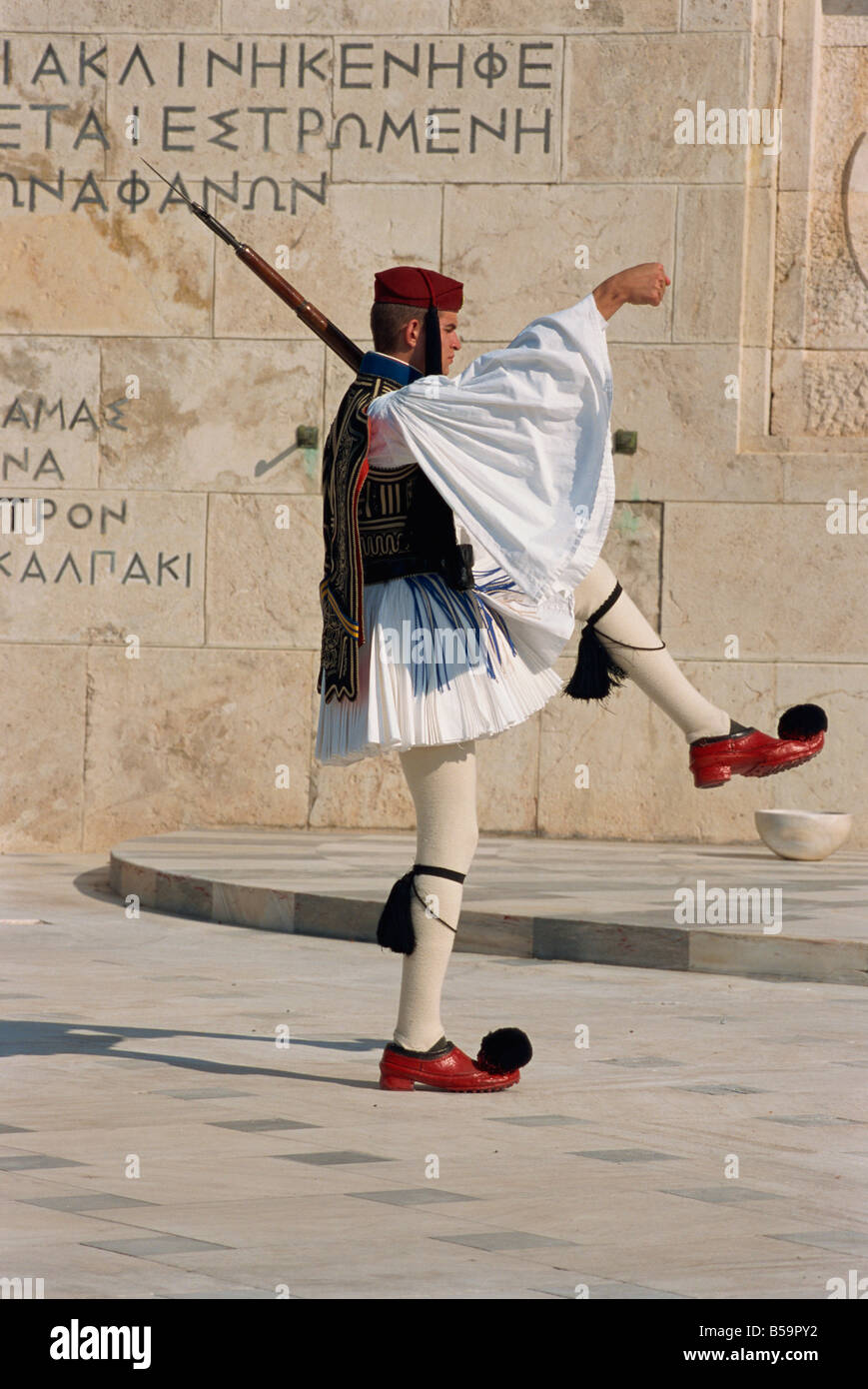 Evzon Guard in traditional dress marching in front of the Tomb of the ...