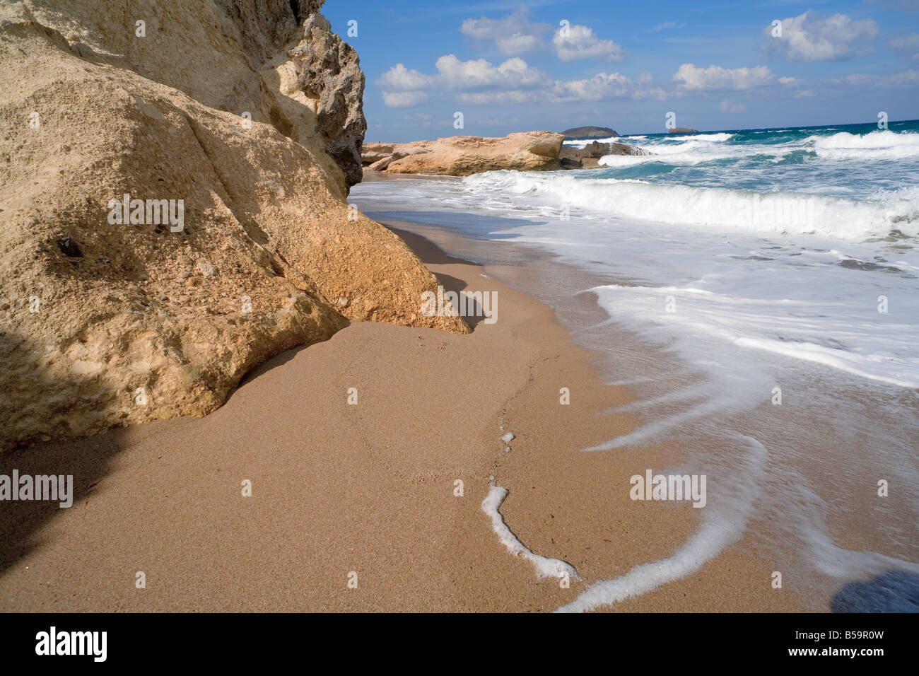 Golden sandy beach on Milos Island, Greece Stock Photo - Alamy