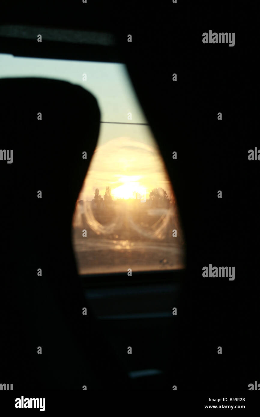 sunset seen through train window Stock Photo - Alamy