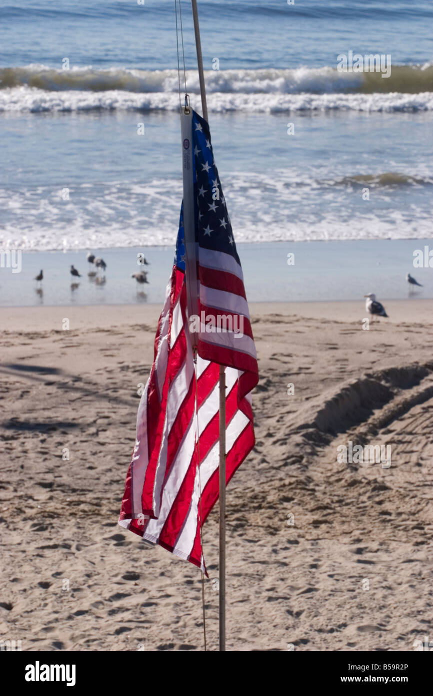 A single US flag on Santa Monica beach, part of a weekend art display ...