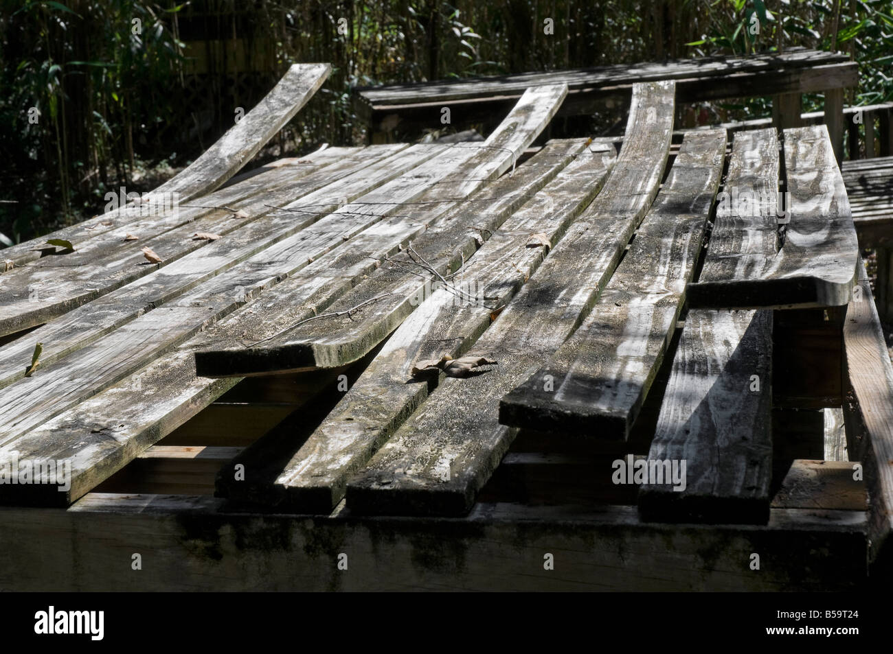 weathered wooden workbench with warped boards Stock Photo - Alamy