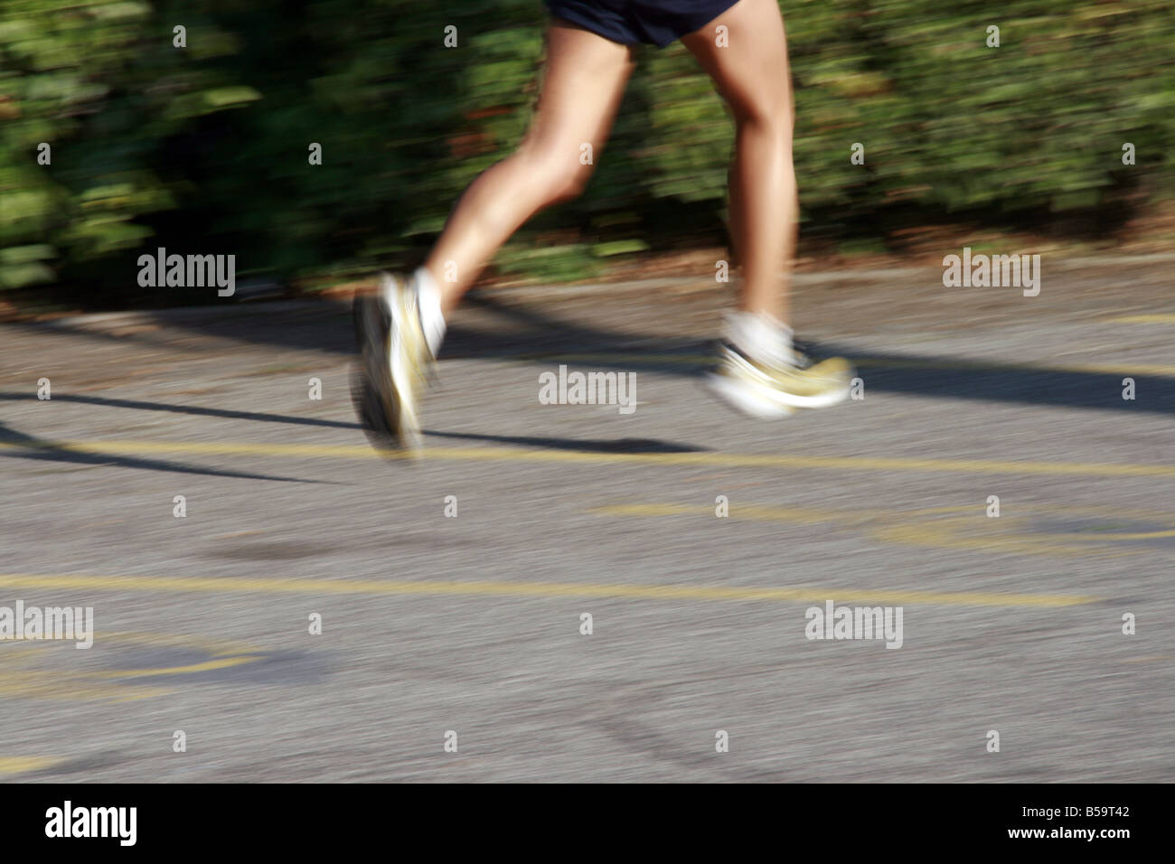 abstract feet of fast runner in park Stock Photo - Alamy