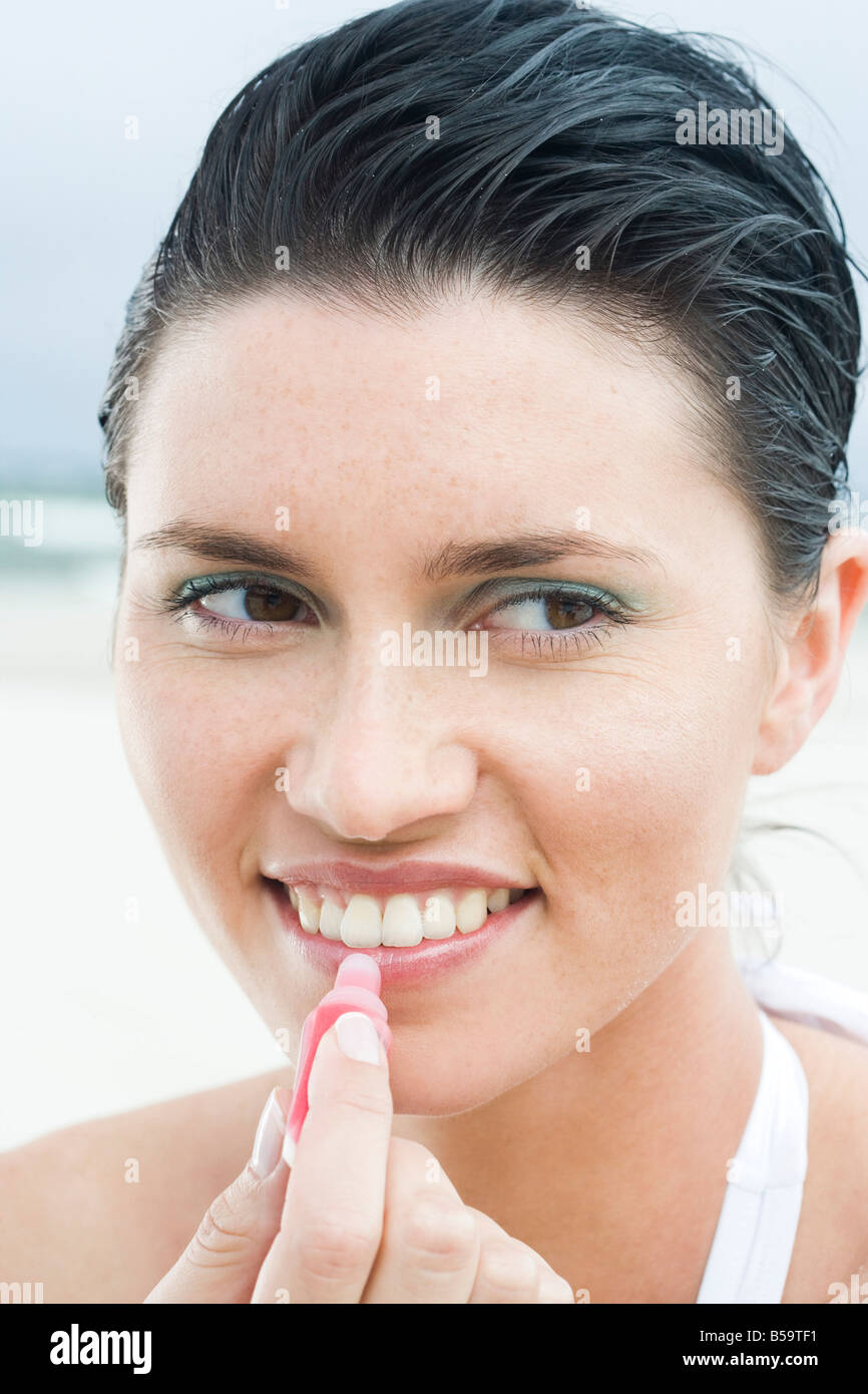 Woman lipbalm beach hi-res stock photography and images - Alamy