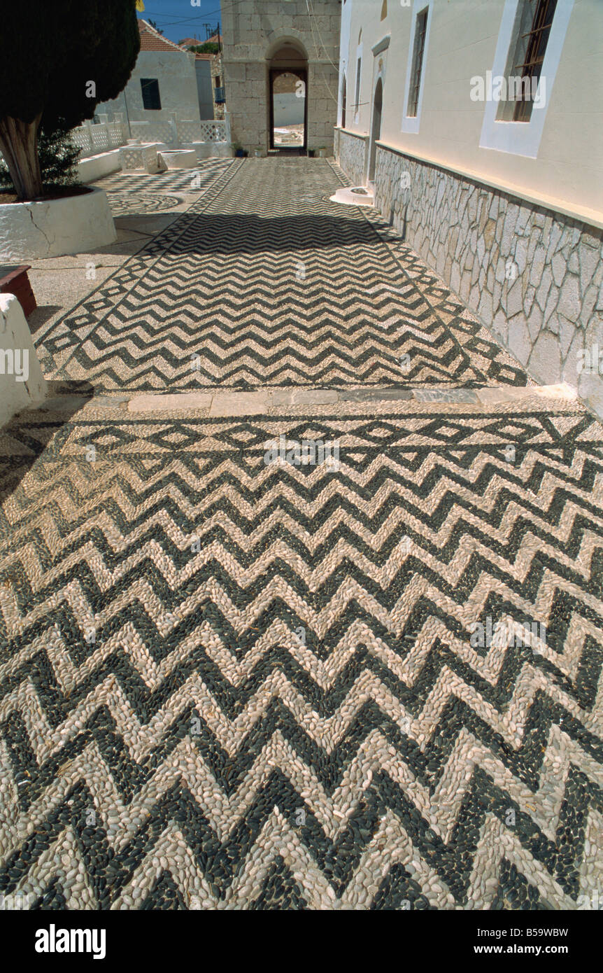 Cobbled pavement by St Nicholas church Chalki Halki Dodecanese Greek ...