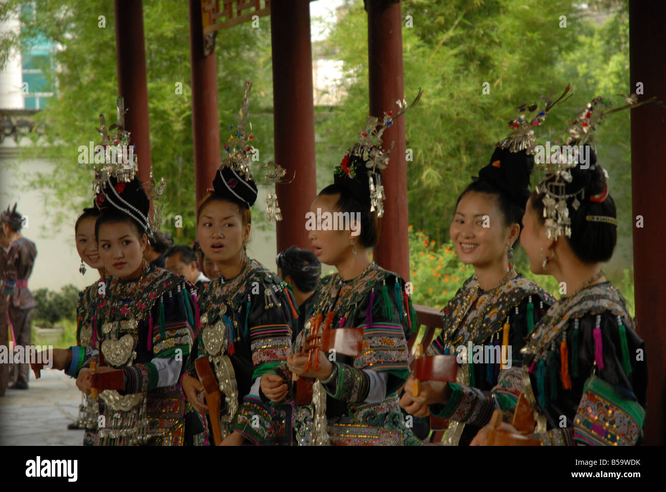 Women prepare to perform traditional music. They are members of the ...