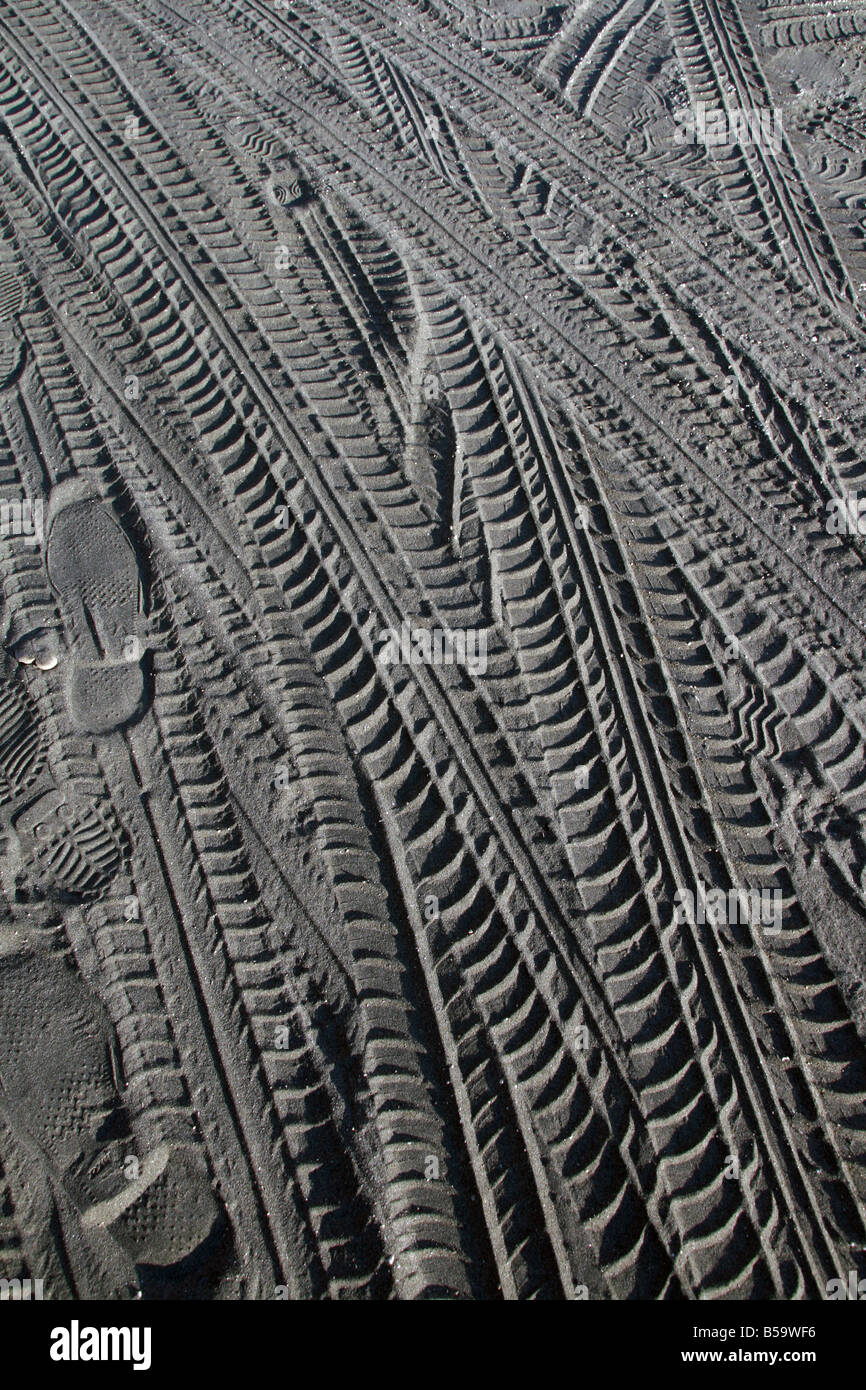 many cars tyre tracks crossing in sand in sun Stock Photo - Alamy