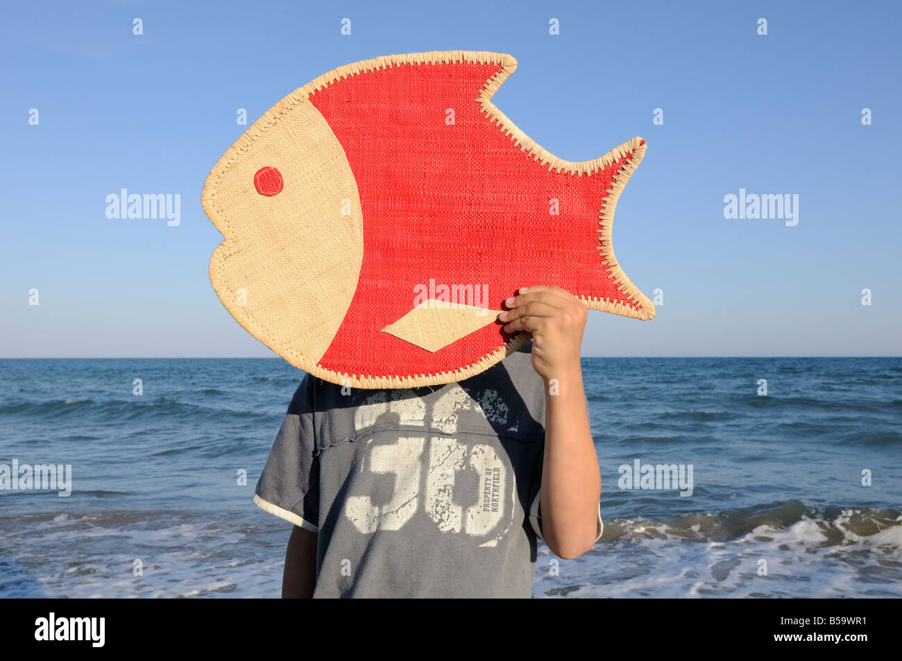 a child behind a fish Stock Photo - Alamy