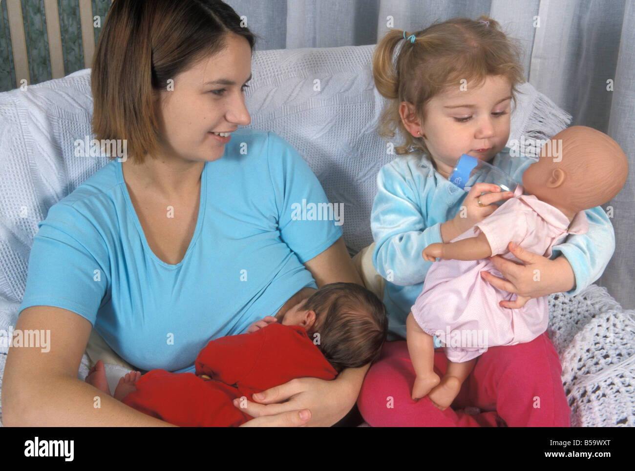 Girl imitating mother hi-res stock photography and images - Alamy