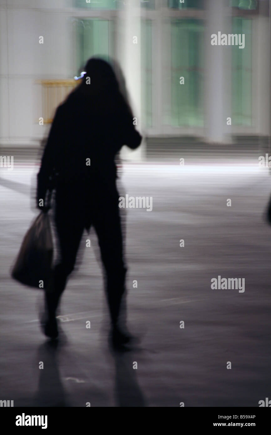 one person walking in street at night Stock Photo - Alamy