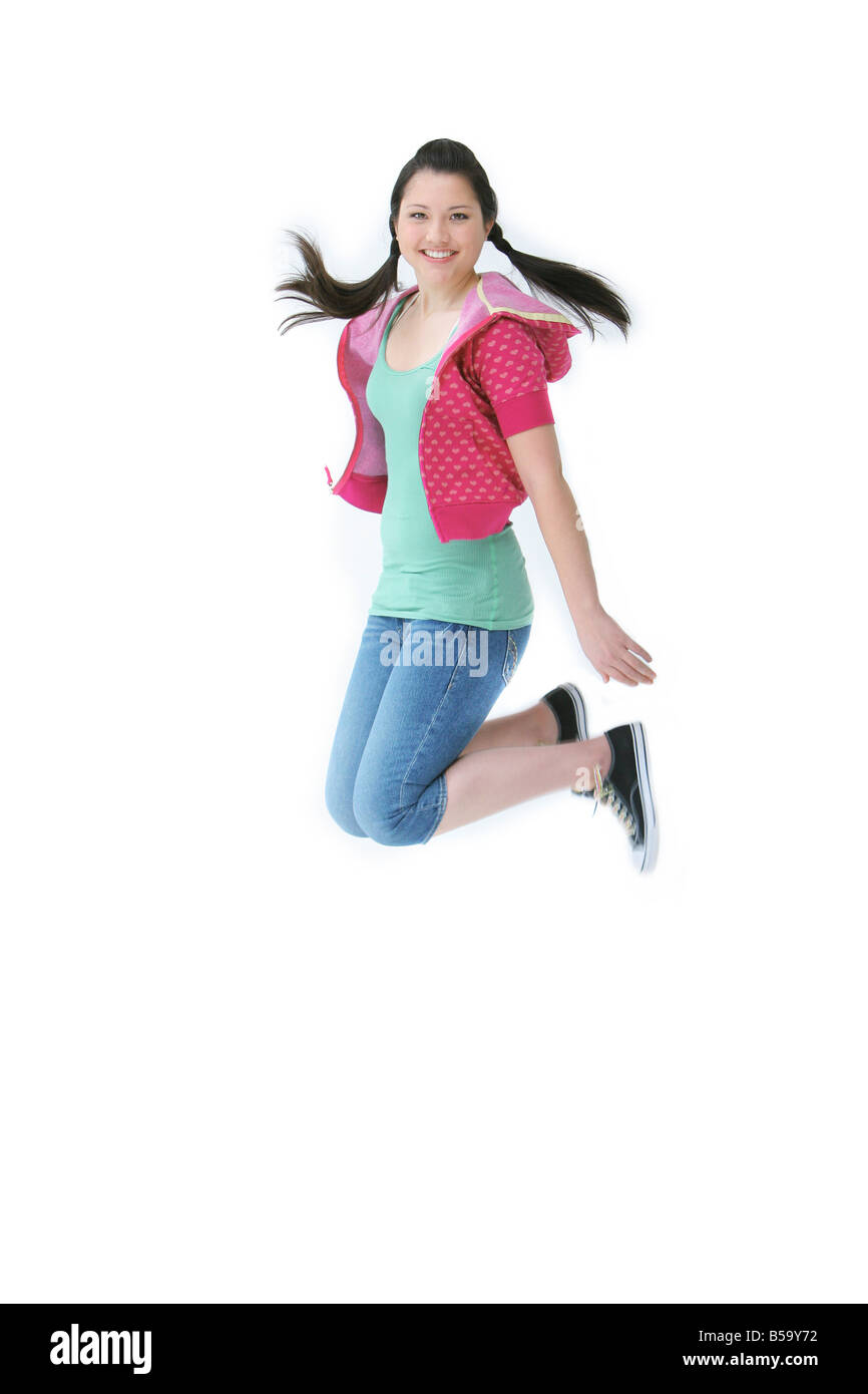 Teenage girl in mid jump Stock Photo - Alamy
