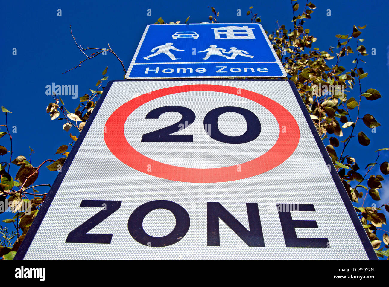 home zone traffic sign with speed limit sign in a residential street in ...