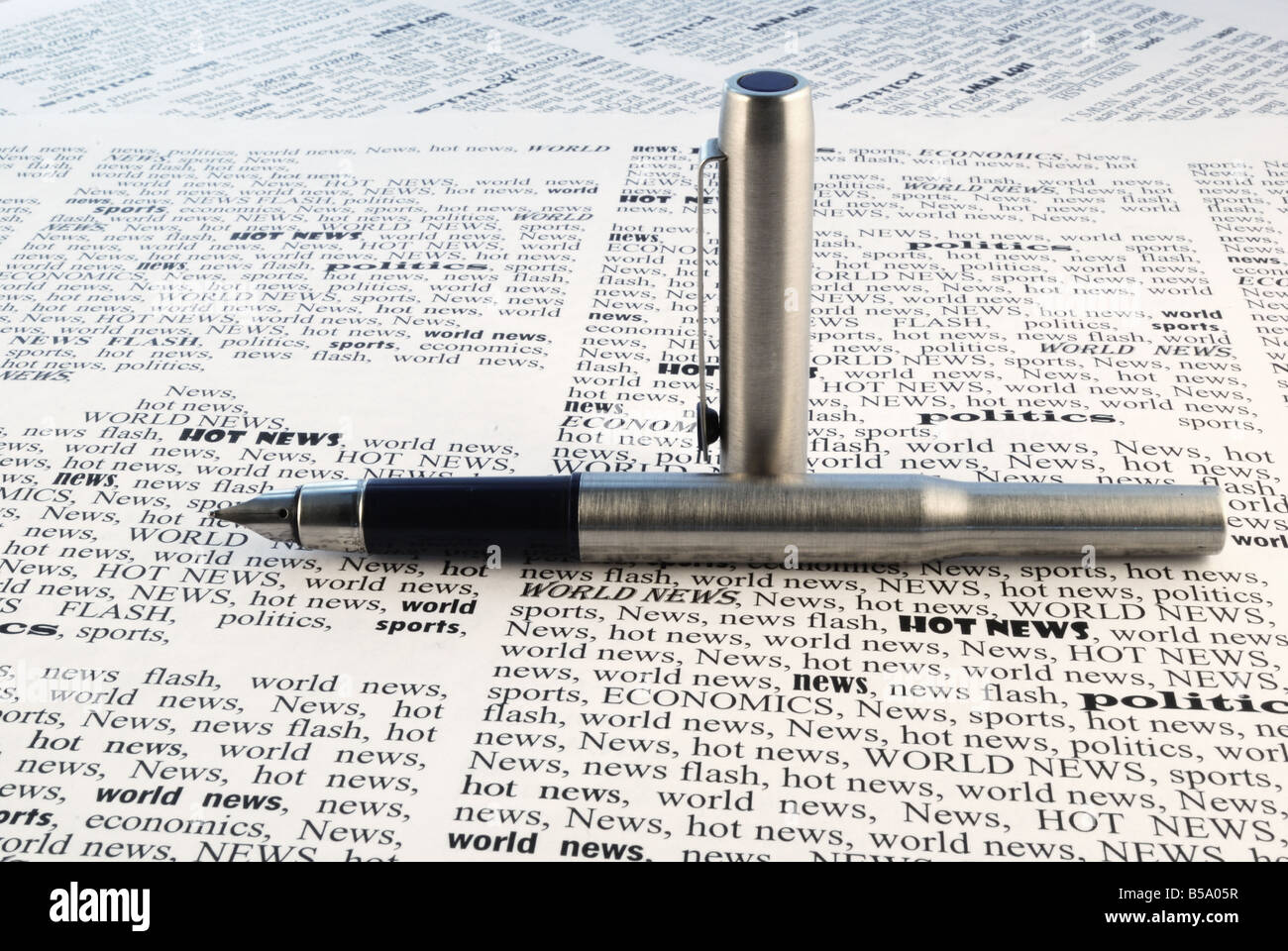 we take all news fountain pen above a newspaper closeup Stock Photo - Alamy
