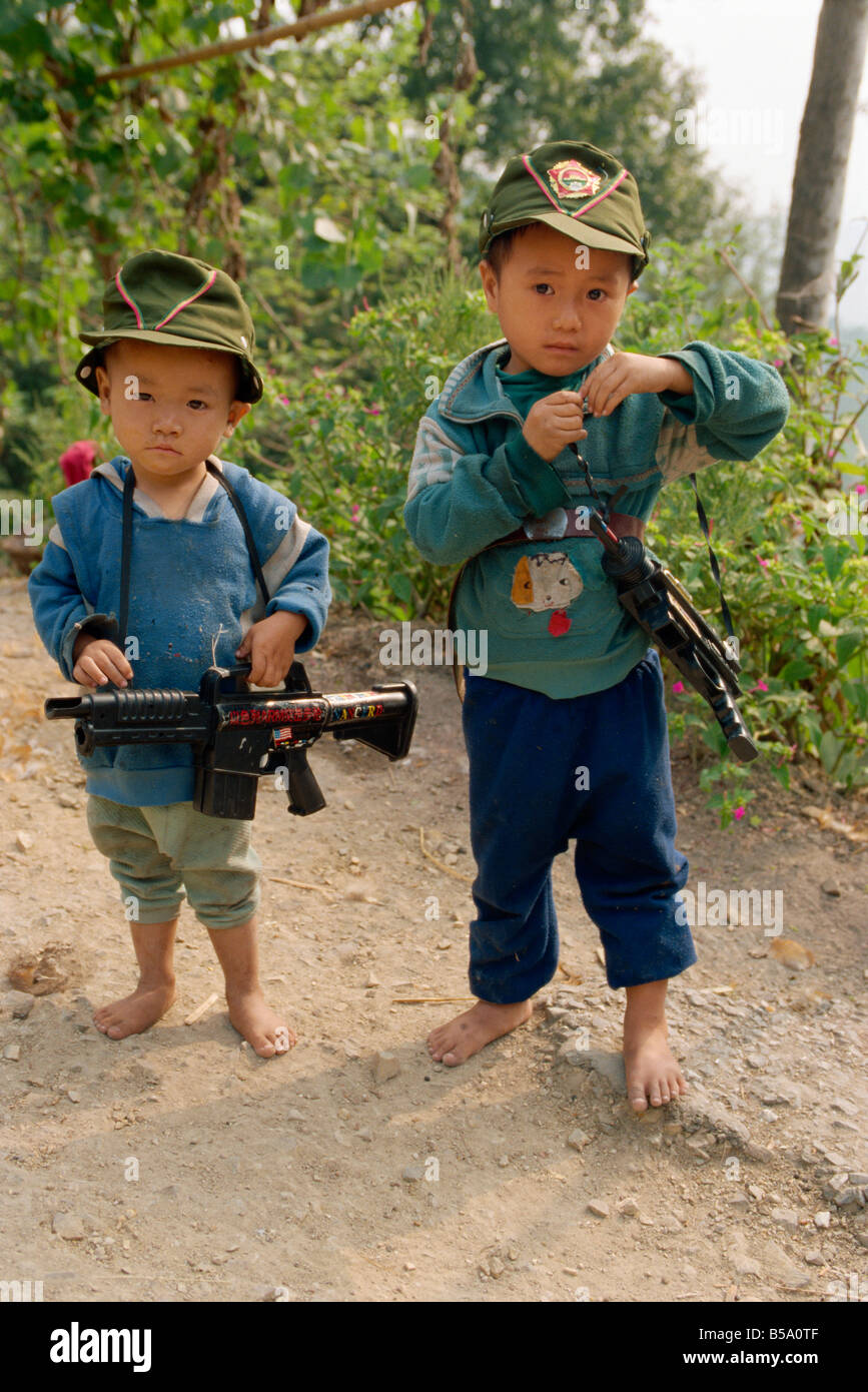 Portrait of two boys with modern toy guns in Guizhou China G Corrigan ...