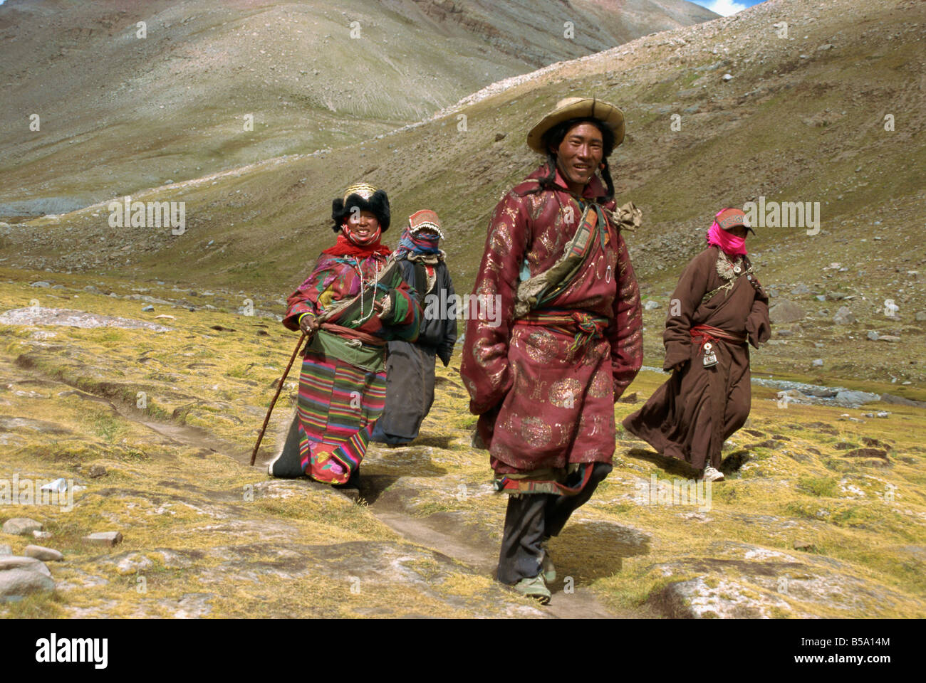 Tibetan Buddhist pilgrims on the kora, walking around Mount Kailas ...