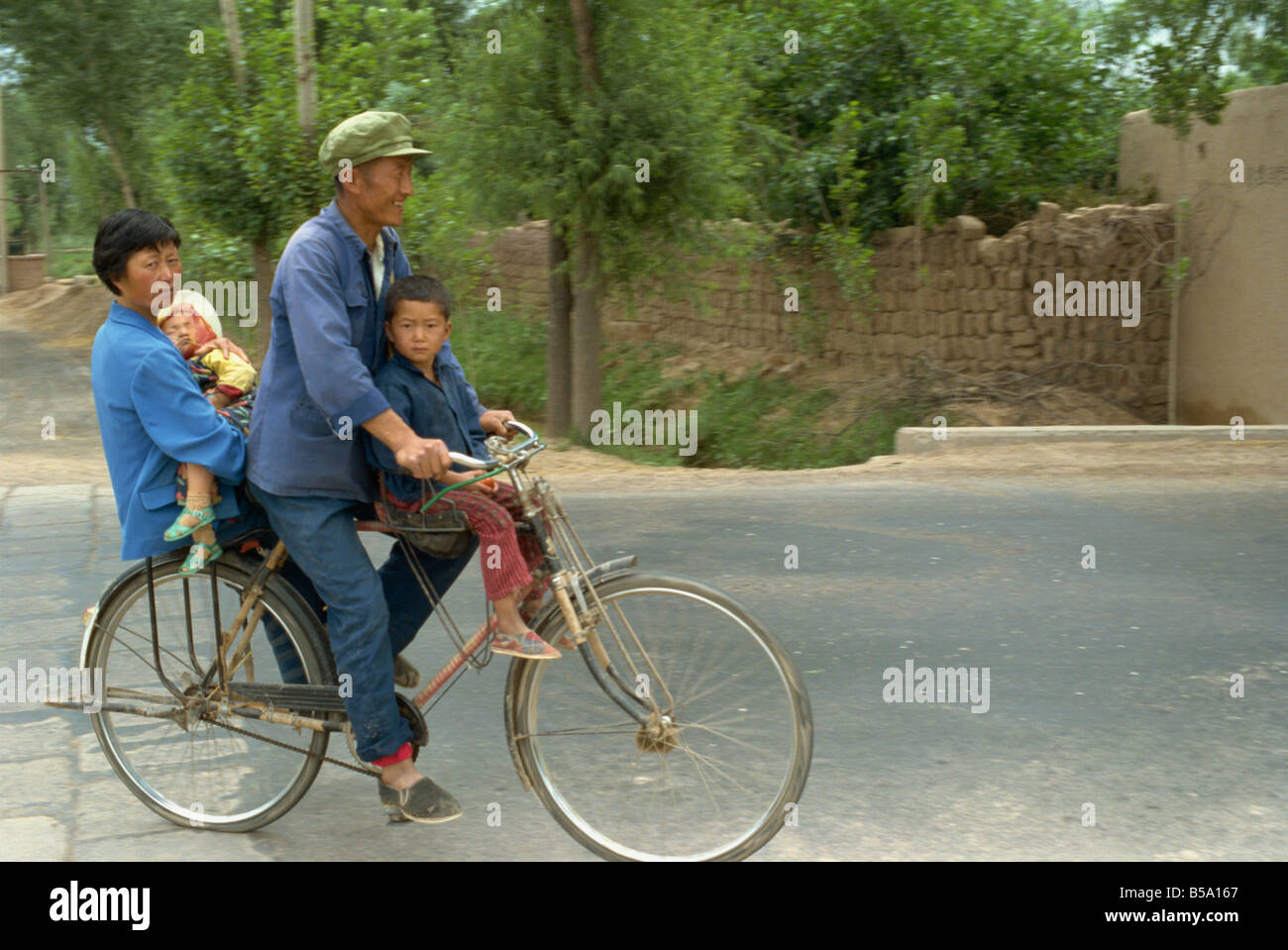 Chinese ethnicity riding bicycle hi-res stock photography and images ...