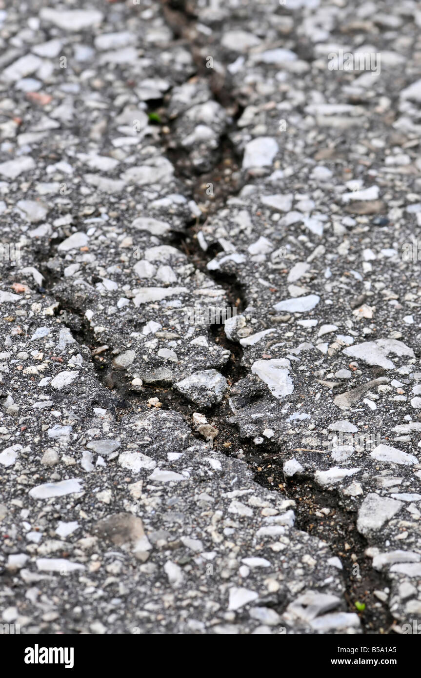 Crack in old asphalt pavement close up Stock Photo - Alamy