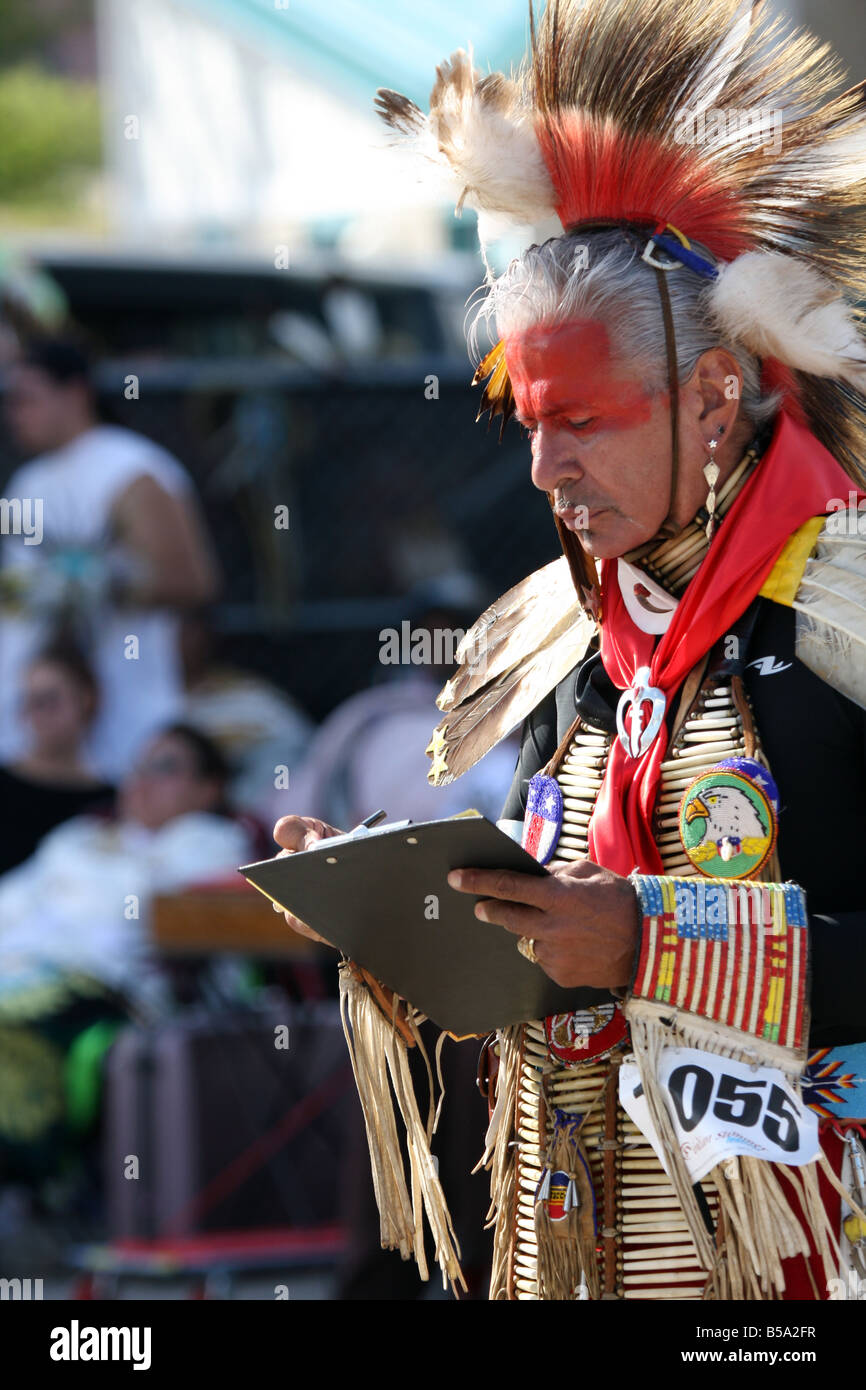 A Native American Indian judge who is judging and recording scores ...