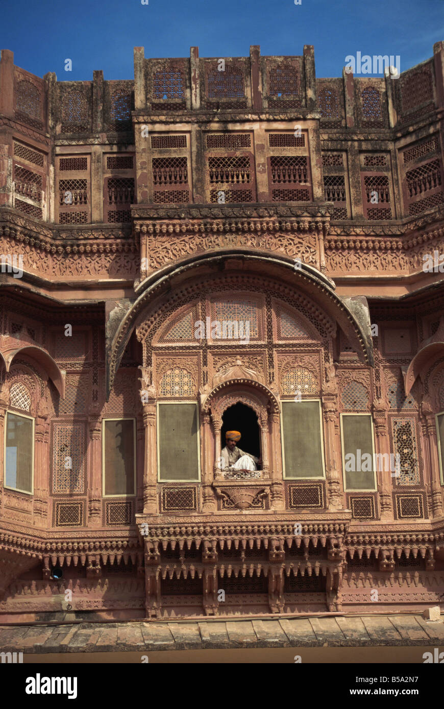 Guard sitting by window City Palace Udaipur Rajasthan state India Asia ...