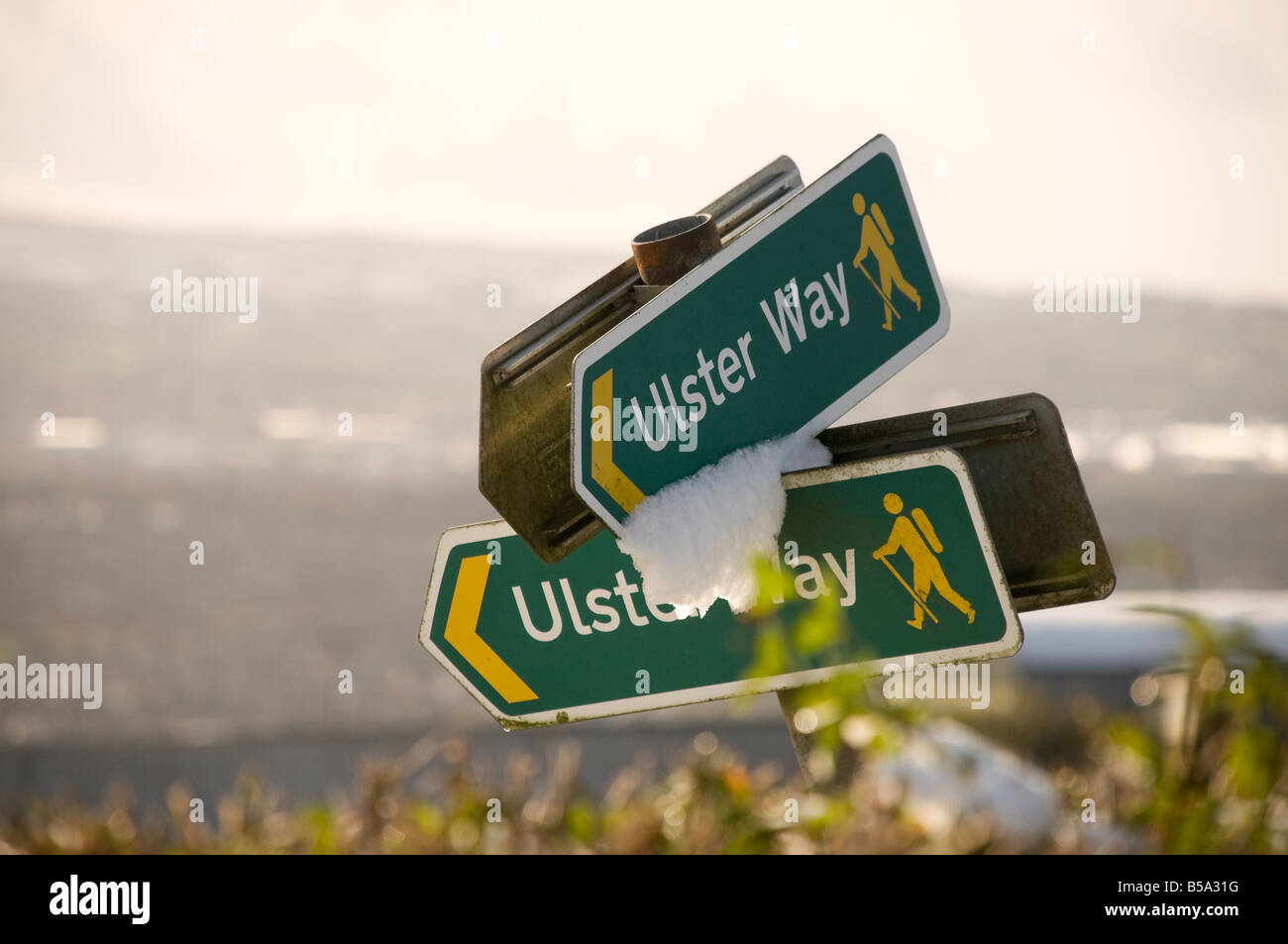 Ulster Way sign with snow, hills in background Stock Photo - Alamy