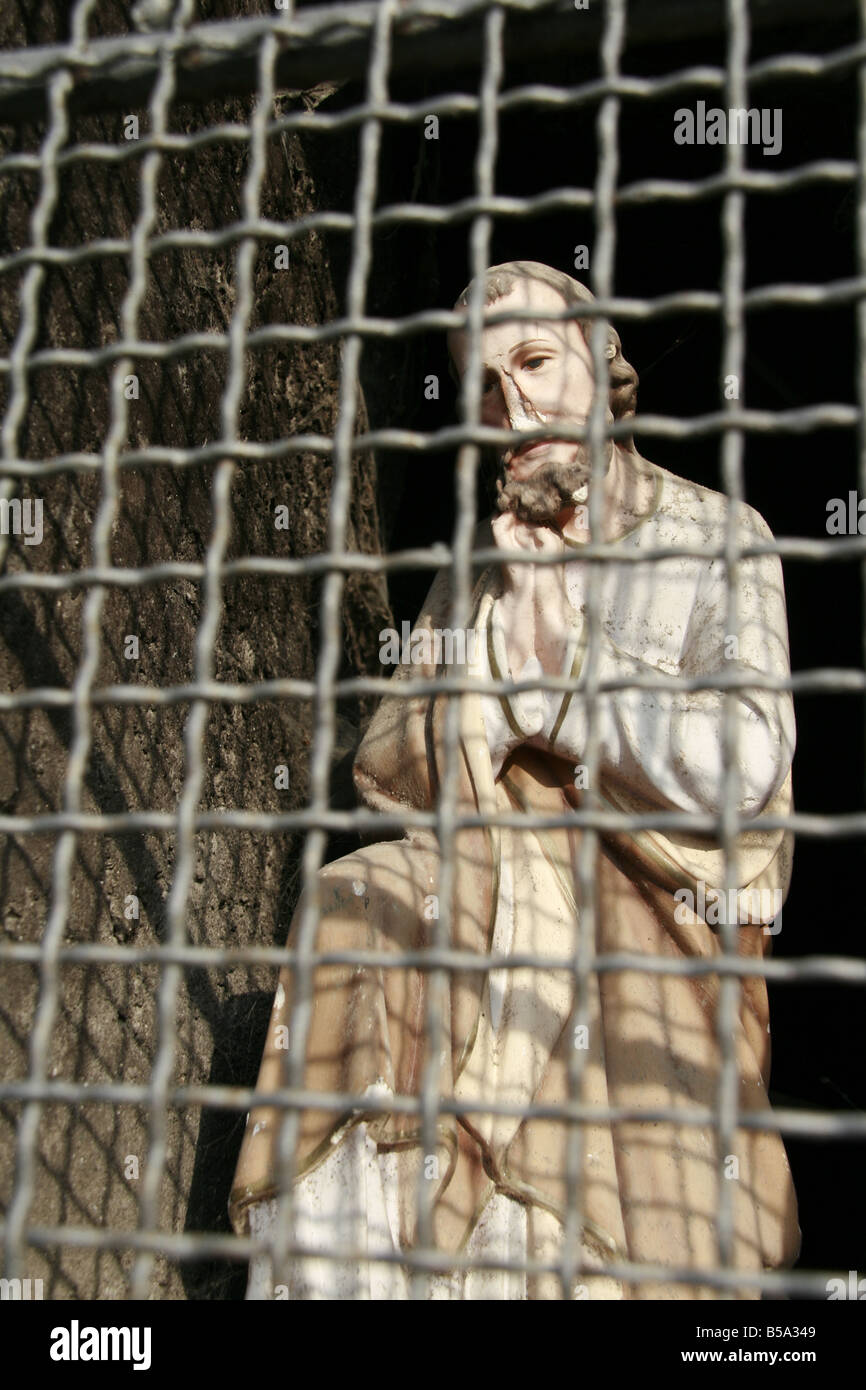 religious man statue at road side altar in italy Stock Photo - Alamy