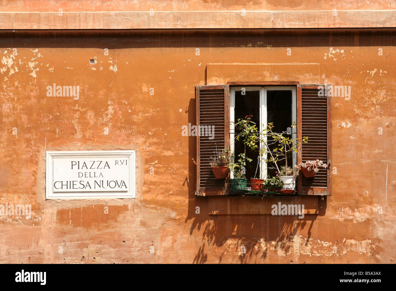 Window with shutters and flower pot, Rome, Italy. Classic Mediterranean ...